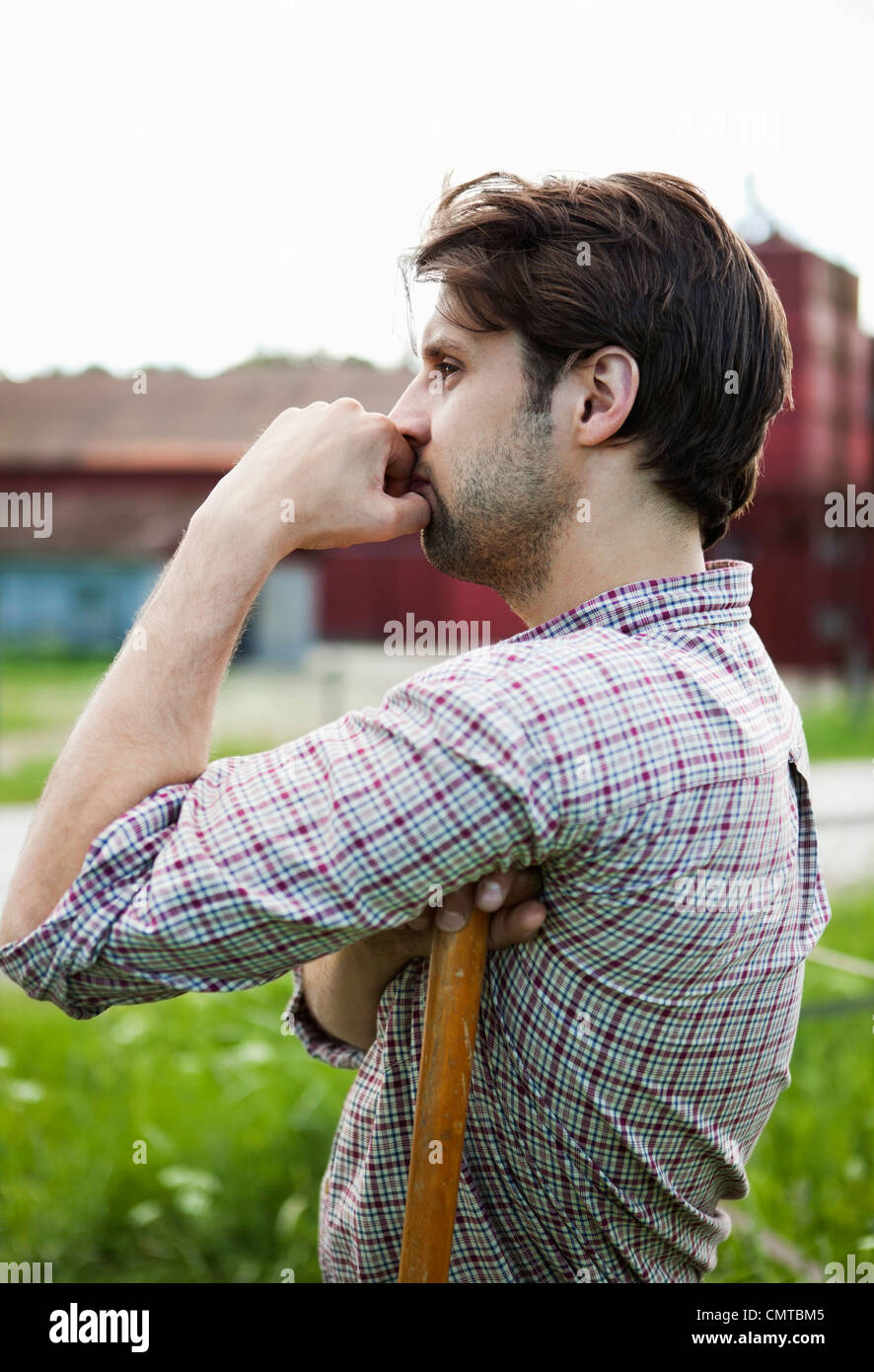 Side view of man lost in thoughts Stock Photo - Alamy