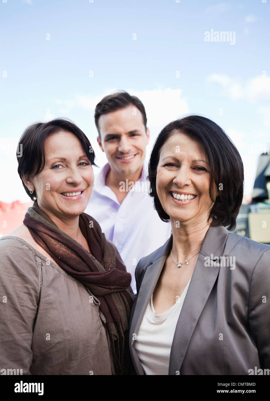 Group of three happy business colleagues Stock Photo - Alamy