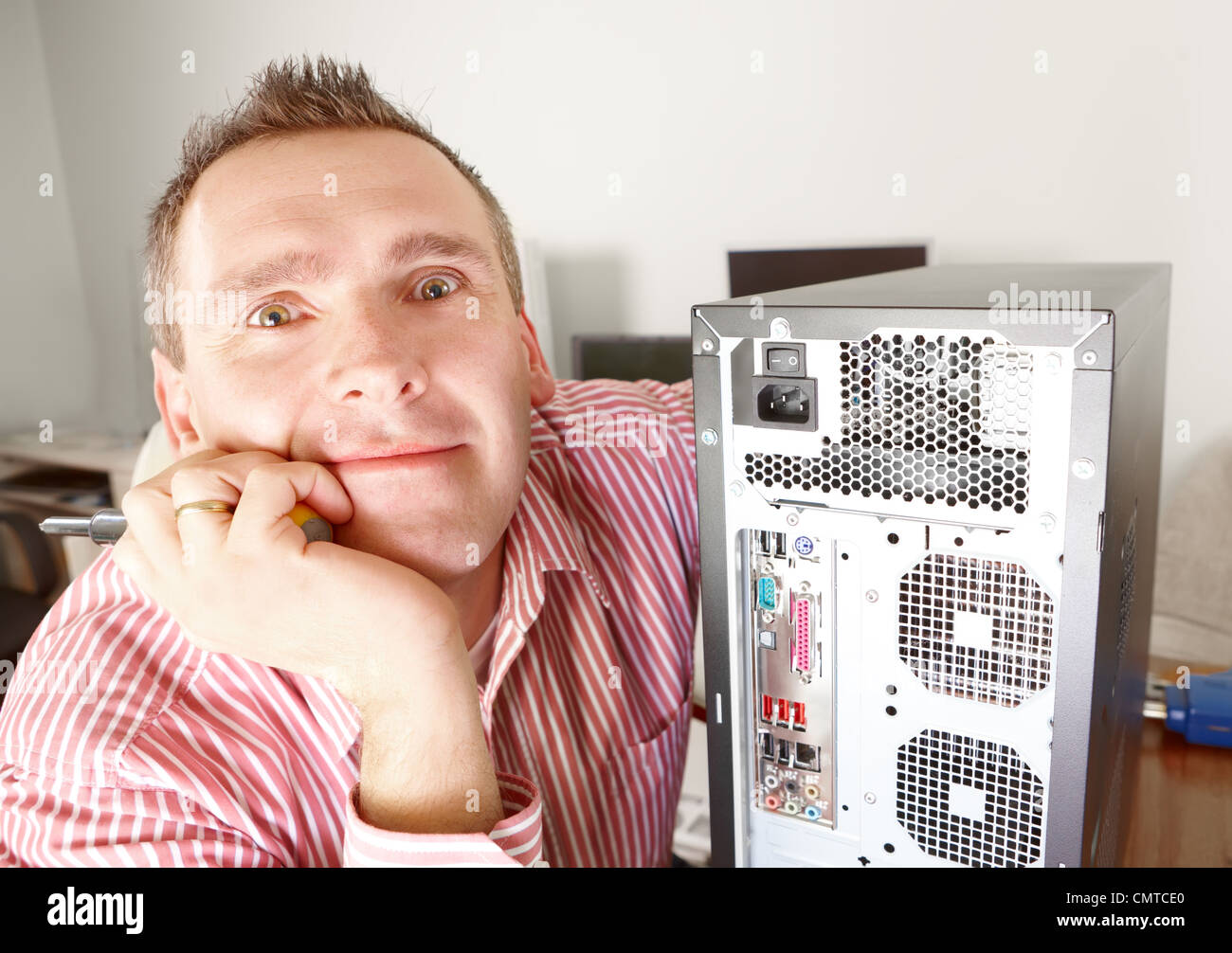 Repairman with computer or private owner of the stuff thinking how to ...