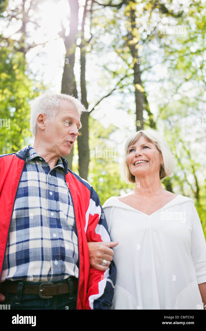 Men and women arm in arm Stock Photo - Alamy