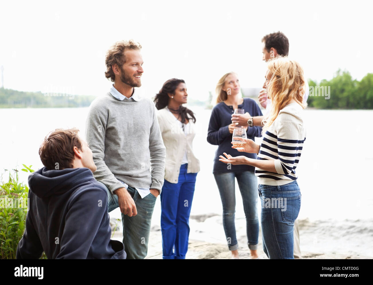 Friends on rock Stock Photo - Alamy