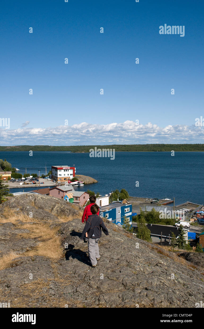 Two young boys playing on Bush Pilots monument overlooking Old Town and ...