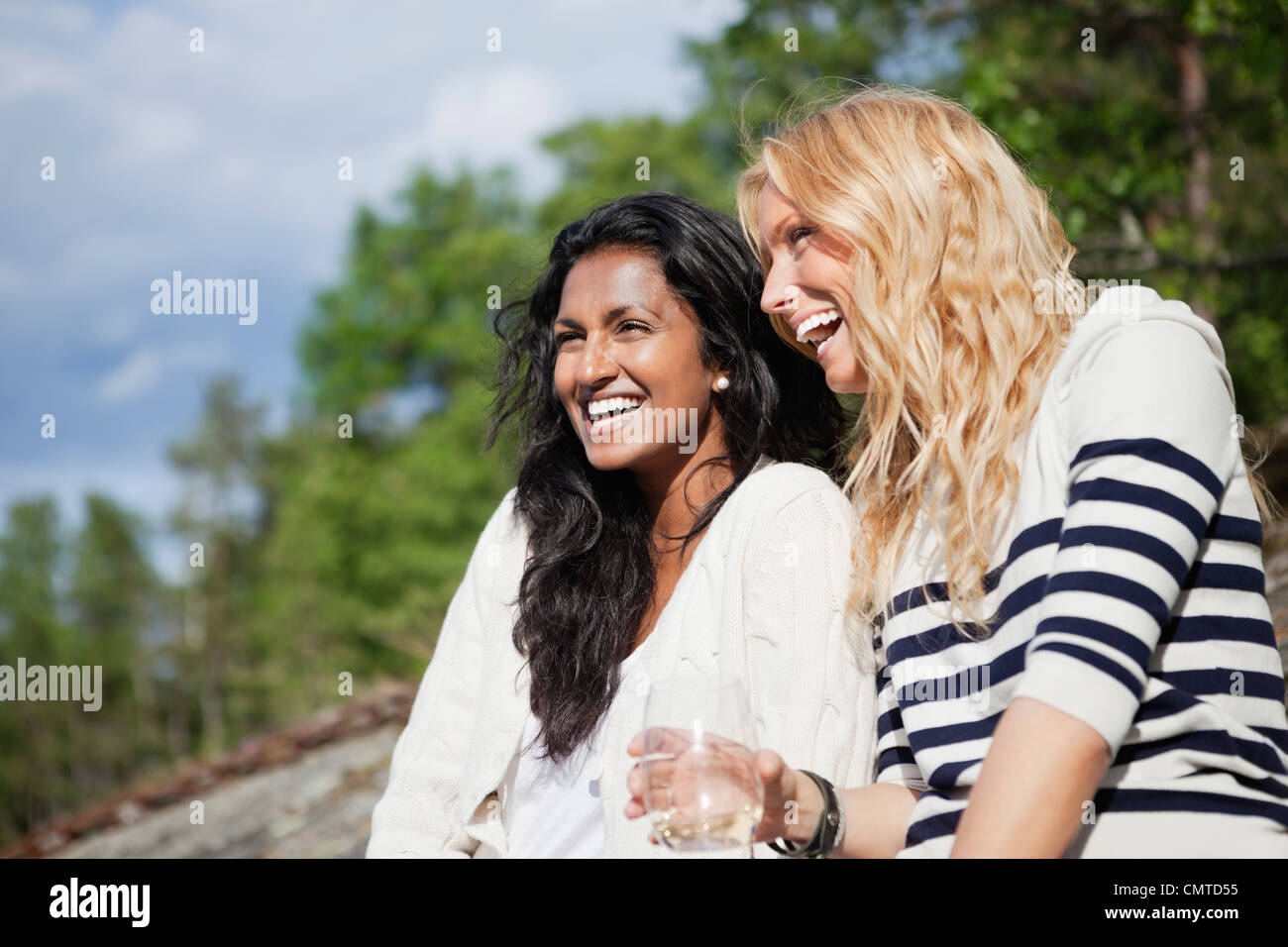 Two cheerful women at party Stock Photo - Alamy