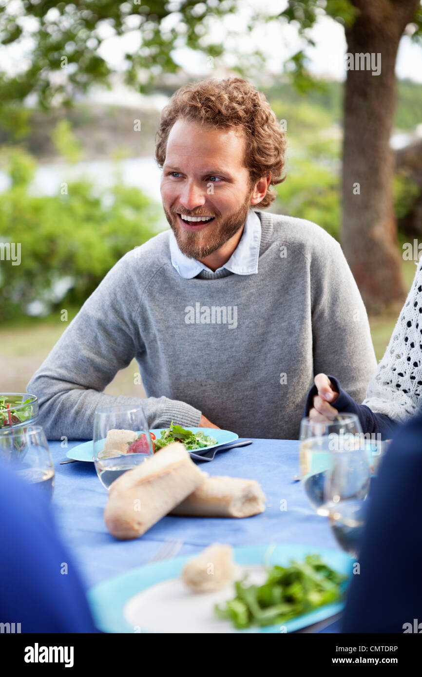 Man with his friends having dinner Stock Photo - Alamy