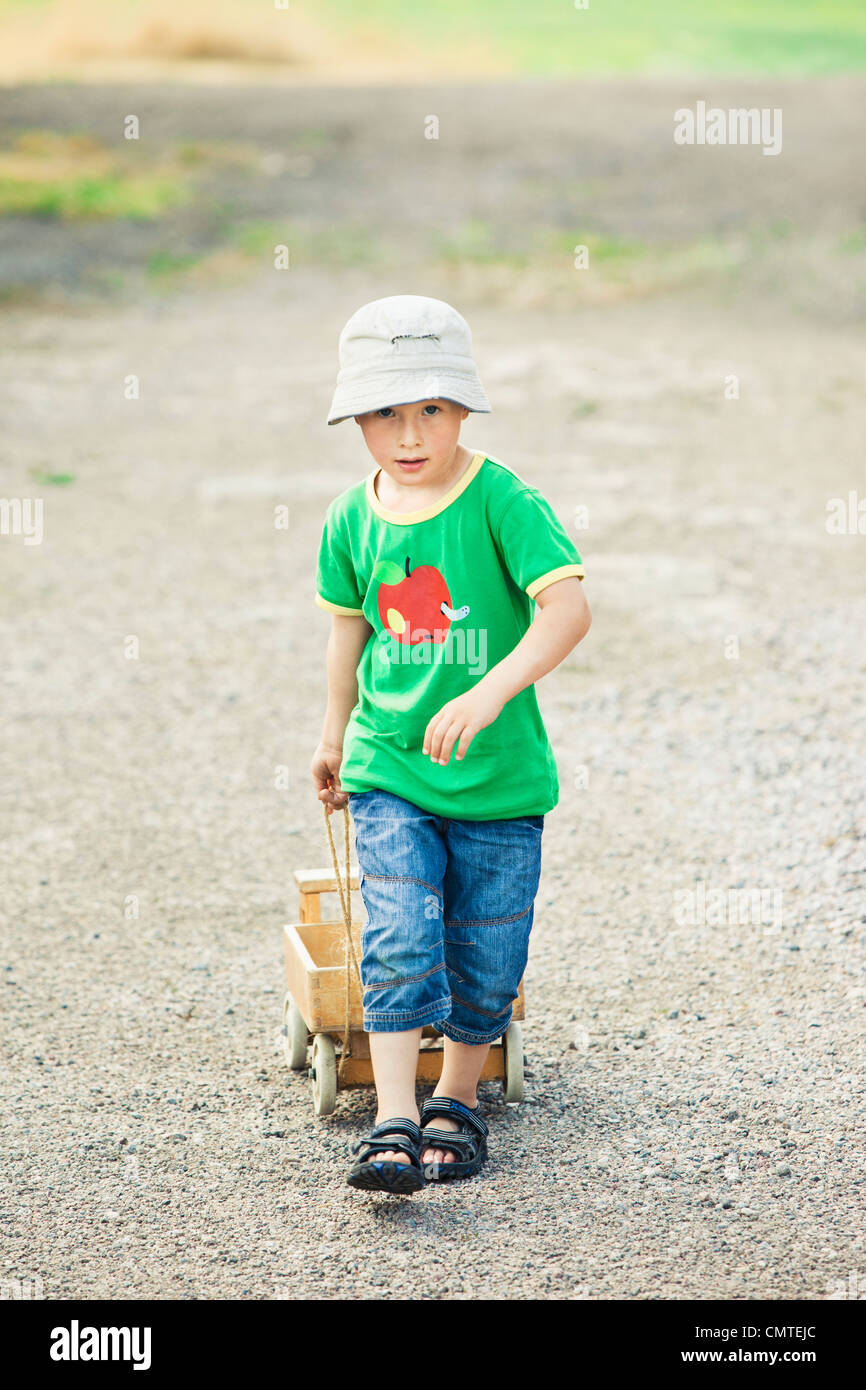 Child on cart hi-res stock photography and images - Alamy