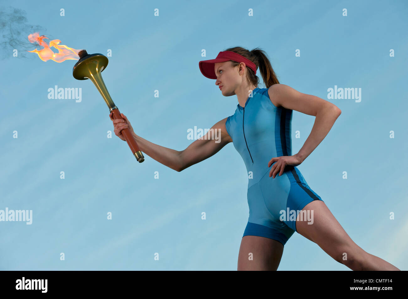 Caucasian athlete holding Olympic torch Stock Photo - Alamy