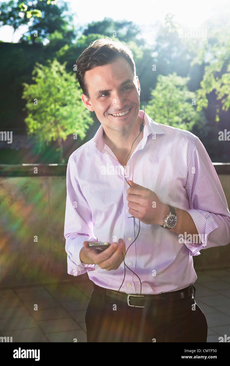 Man having conversation on phone and smiling Stock Photo - Alamy