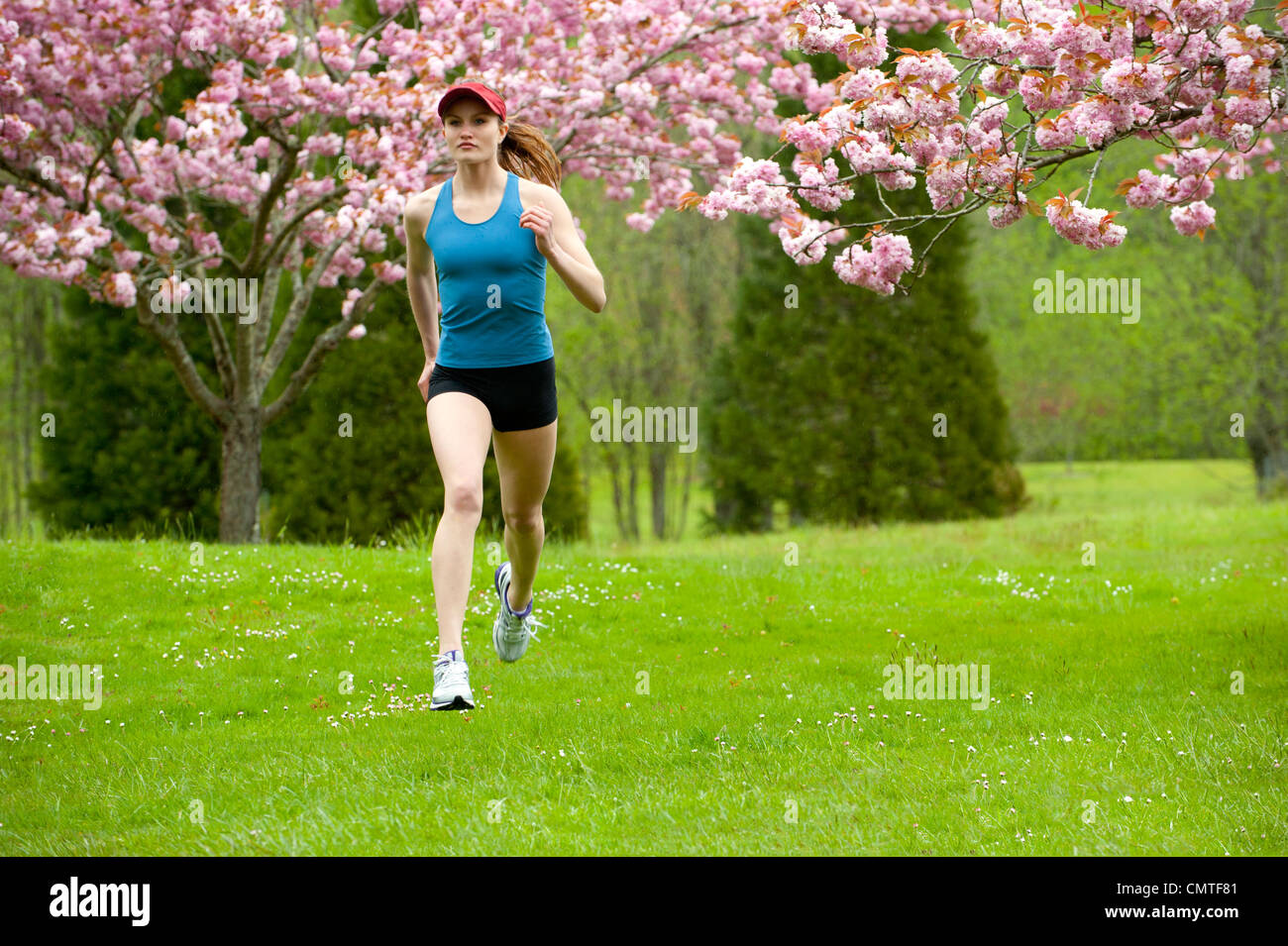 Person running across field hi-res stock photography and images - Alamy