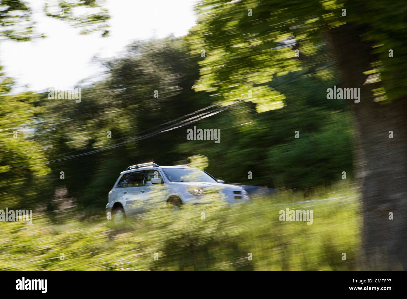 Car driving in the forest hi-res stock photography and images - Alamy