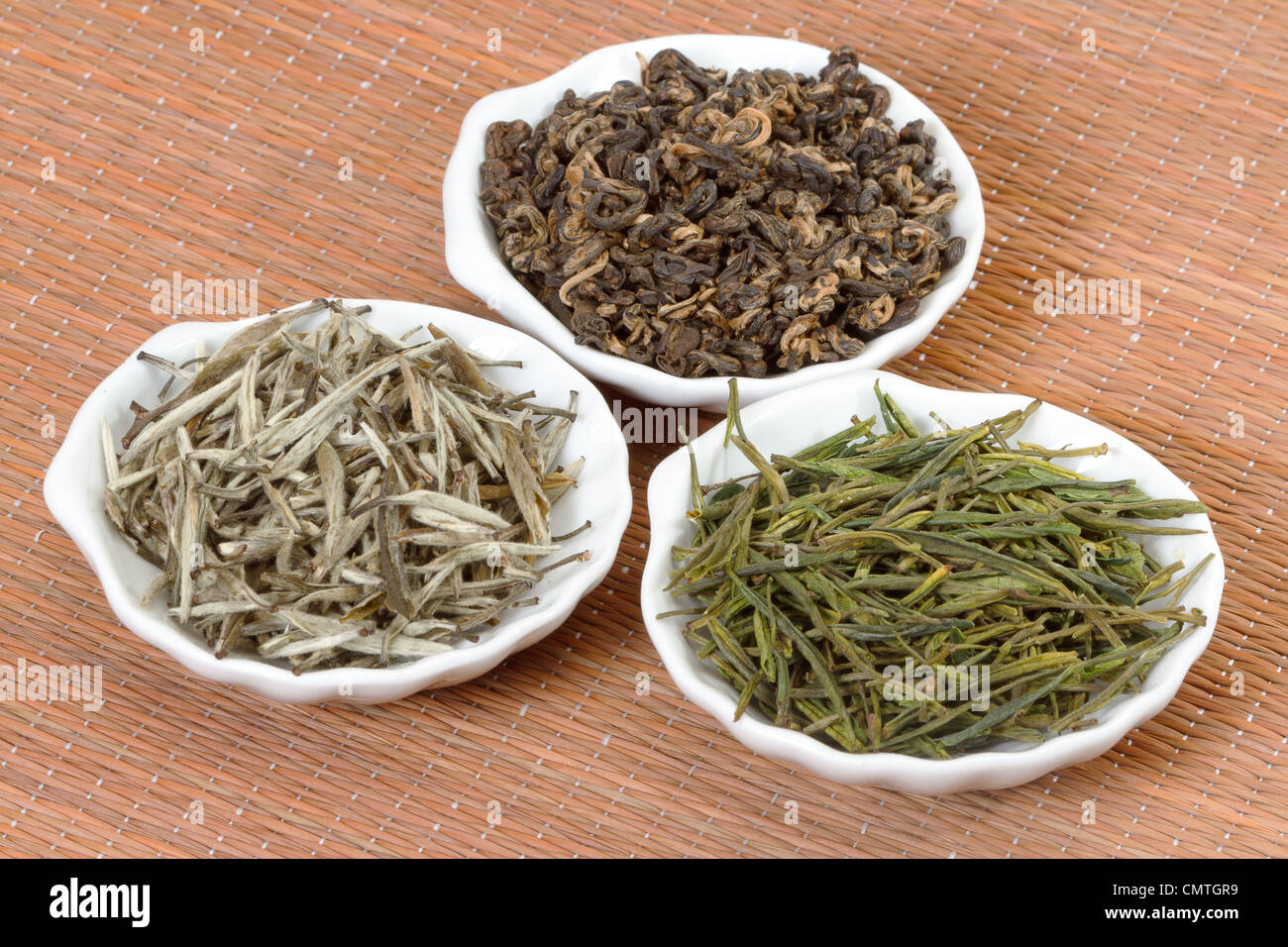 Chinese teas in plates on bamboo mat Stock Photo - Alamy