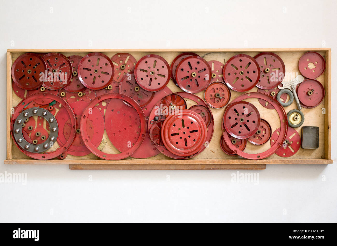 A drawer of red meccano wheels Stock Photo - Alamy
