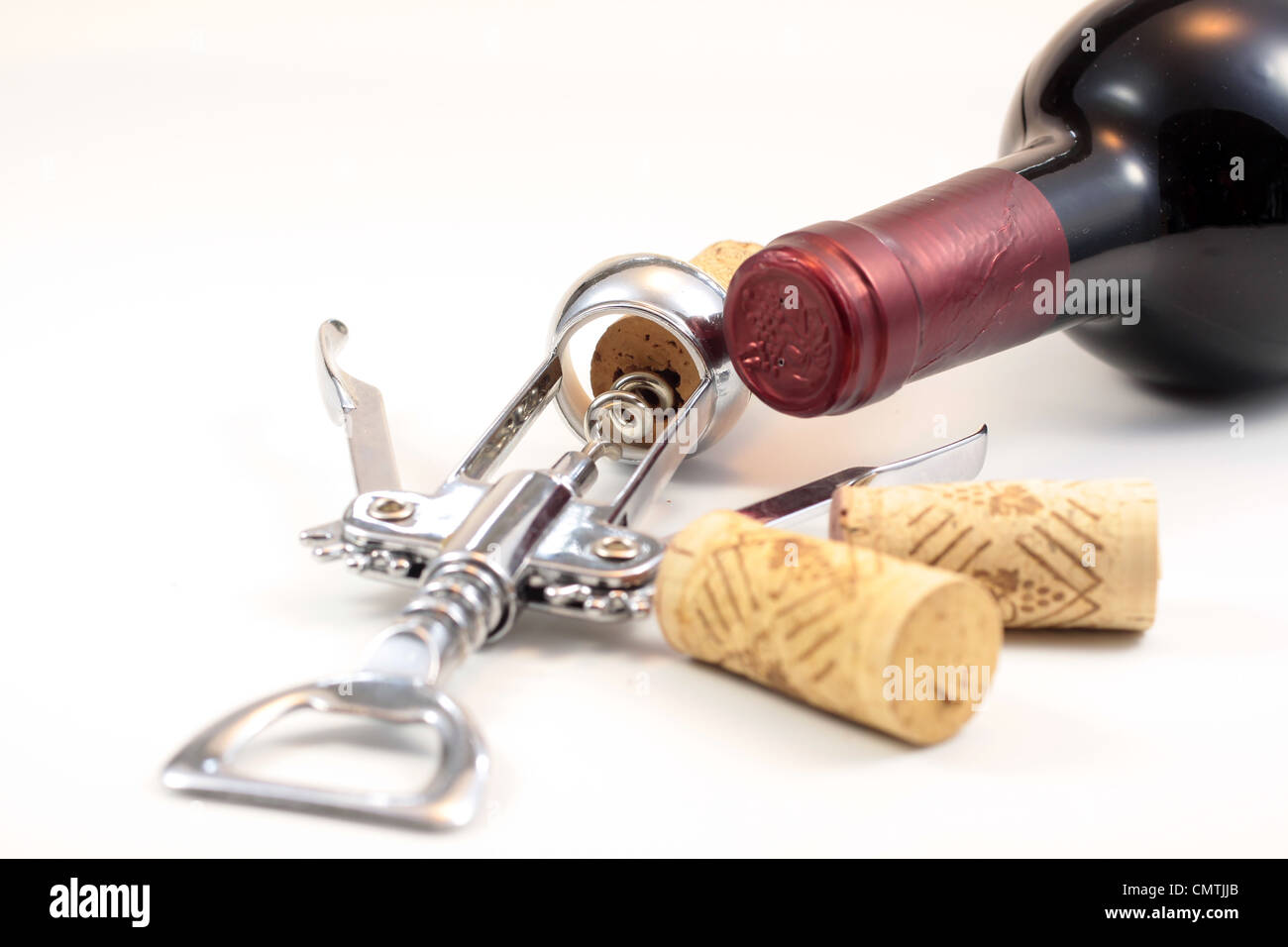 Isolated corks, red wine and corkscrew with white background Stock ...