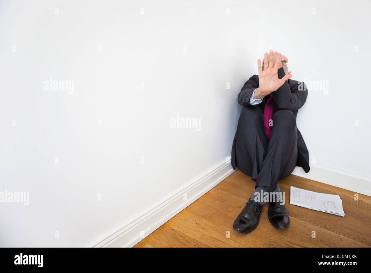 Man in corner Stock Photo - Alamy