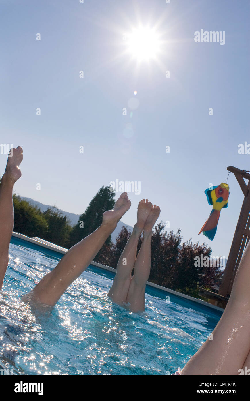 Girls doing hand stands in a swimming pool, Victoria, British Columbia ...
