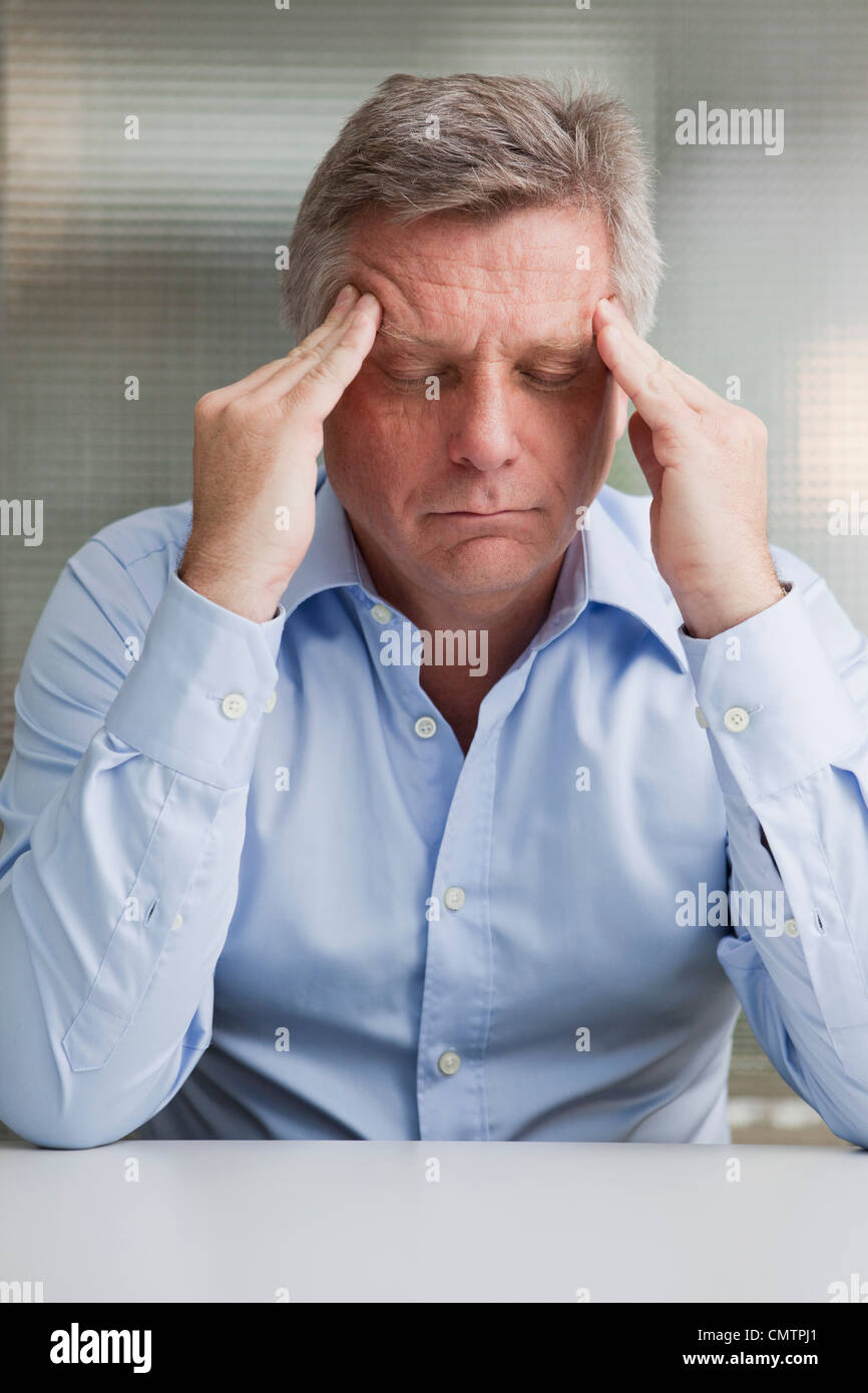 Man touching head Stock Photo - Alamy