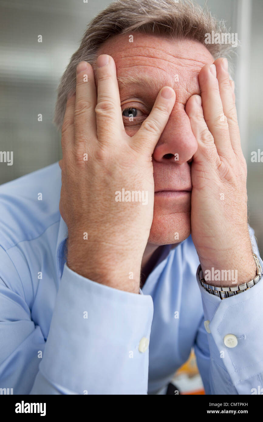 Man holding his head in his hands hi-res stock photography and images ...
