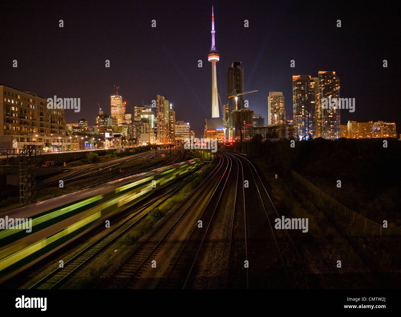 CN Tower and train tracks at night, Toronto, Ontario Stock Photo - Alamy