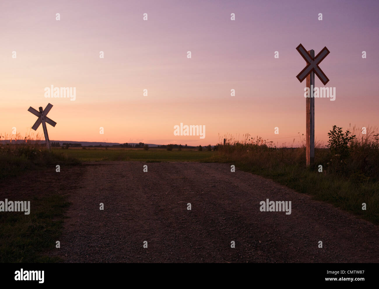 Train crossing signs at sunset, Wolfville, Nova Scotia Stock Photo - Alamy