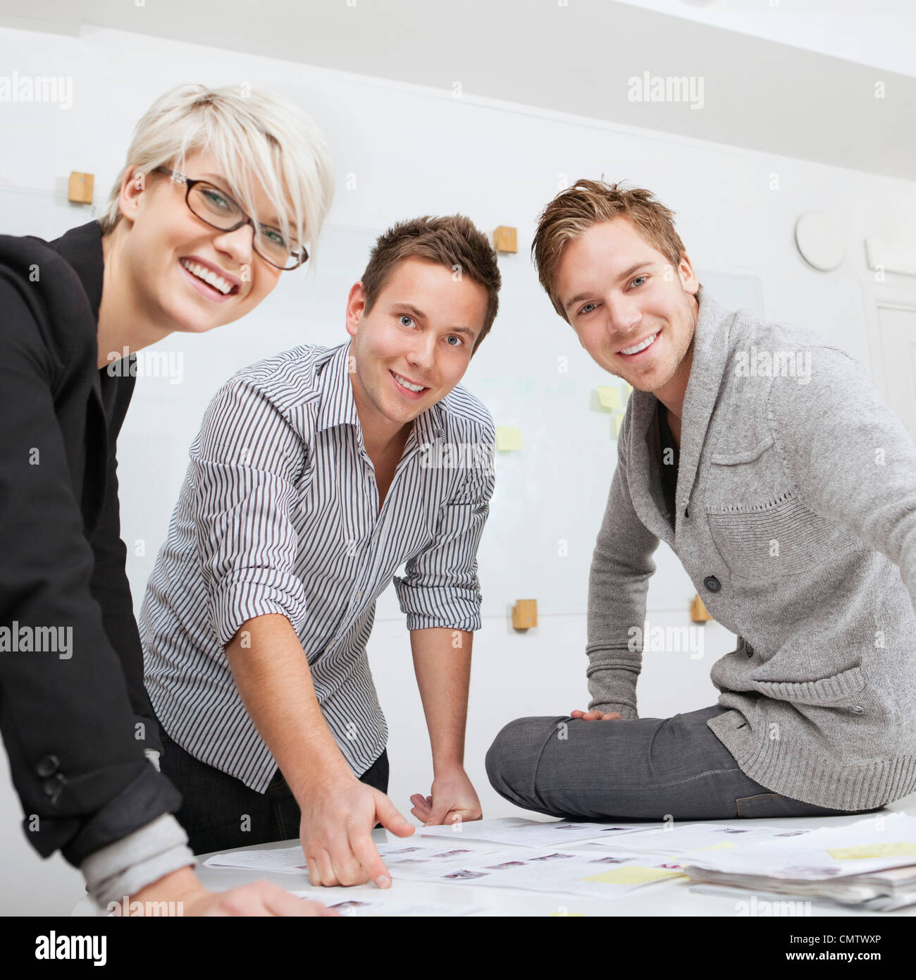 Three happy colleagues Stock Photo - Alamy