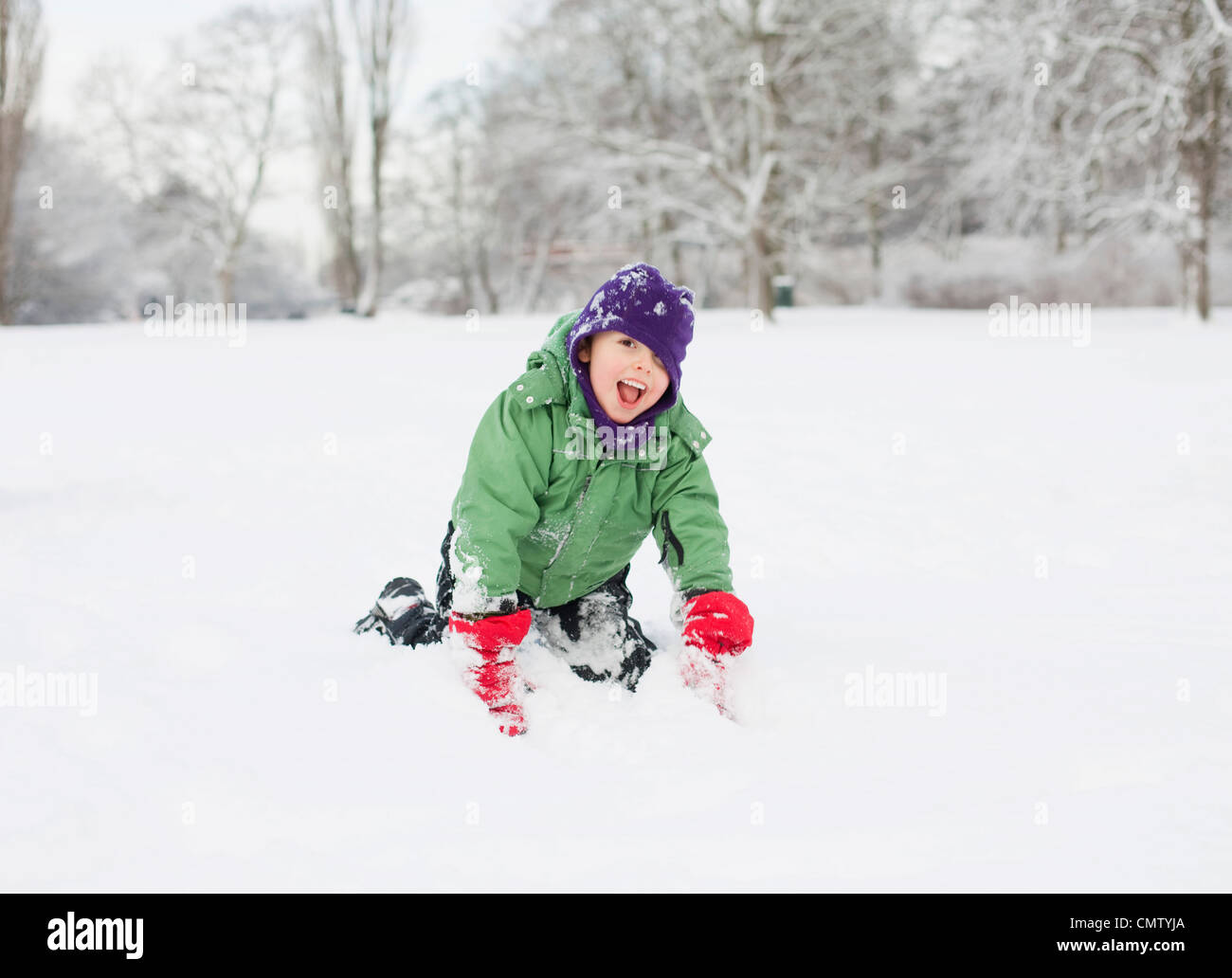 Boy plying in park Stock Photo - Alamy