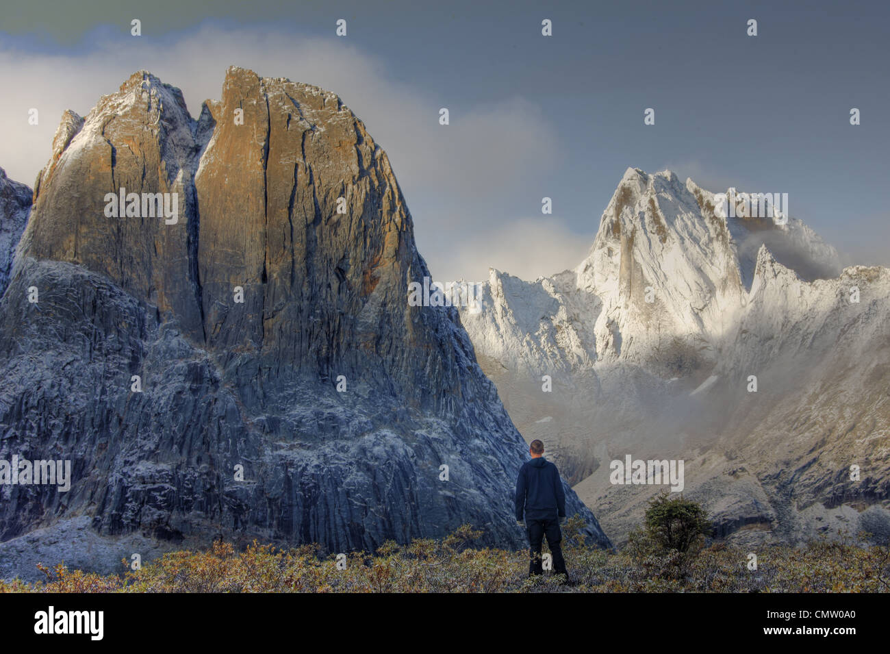 Hiker in front of Mount Monolith at Sunrise, Tombstone Park, Yukon ...