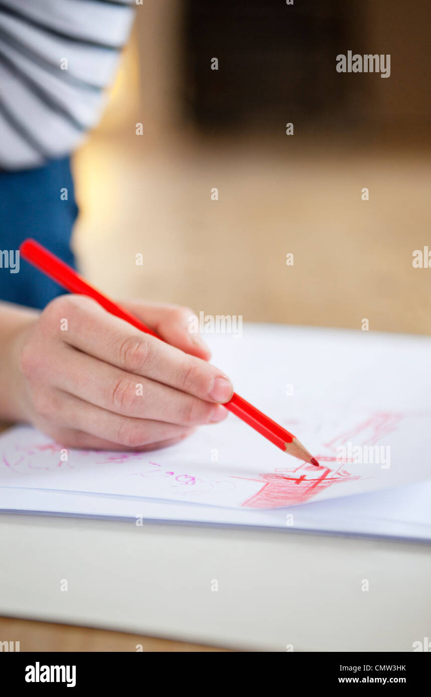 Girl coloring on paper Stock Photo - Alamy