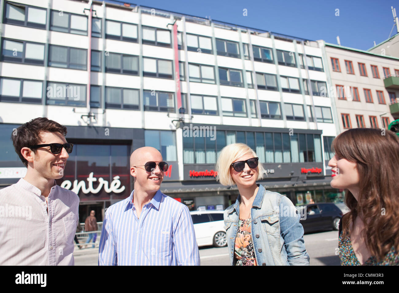 Four standing men hi-res stock photography and images - Alamy