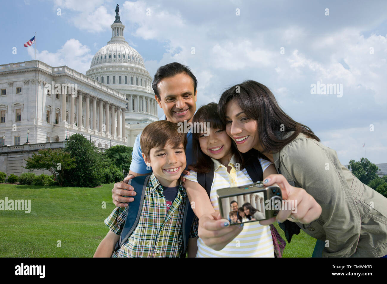 Family taking self-portrait on vacation Stock Photo - Alamy