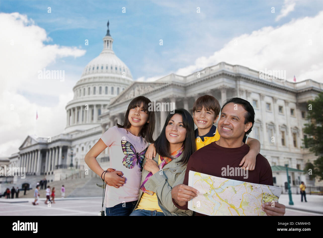Happy family with travel map hi-res stock photography and images - Alamy