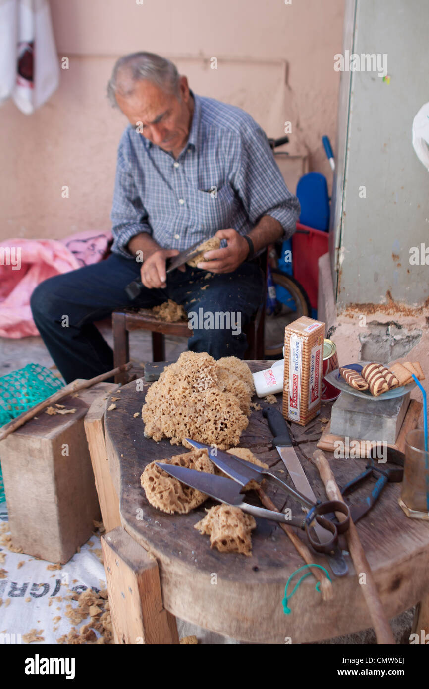 A Man trimming Greek Natural Sponge on the island of Kalymnos, Greece ...