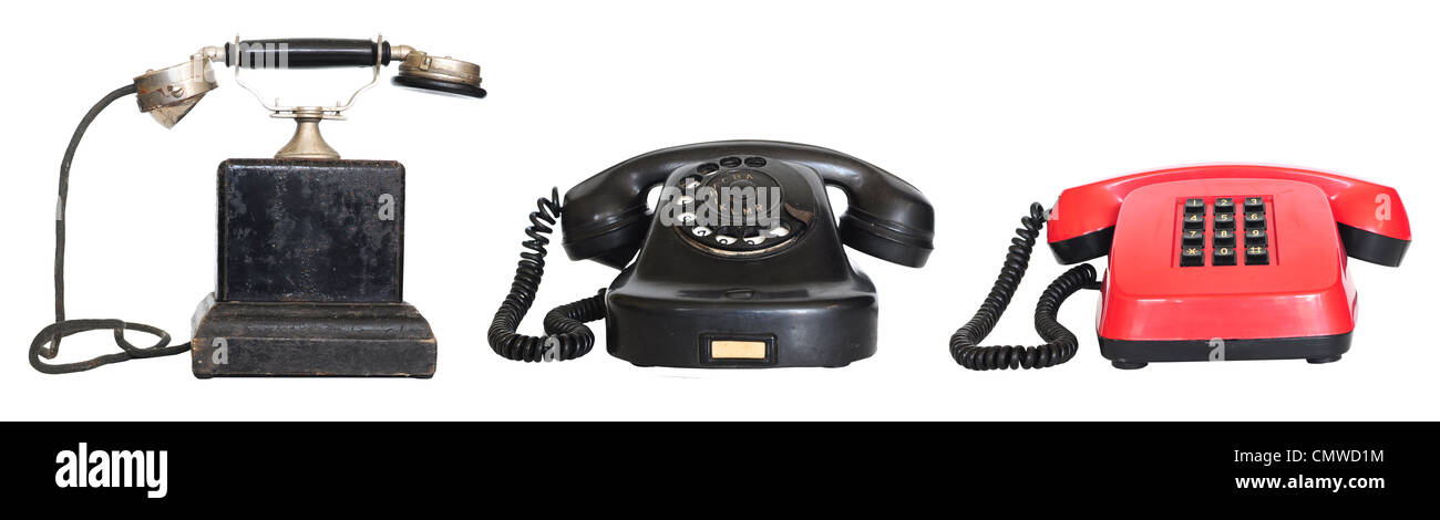 Three vintage telephones from different decades isolated on white Stock ...