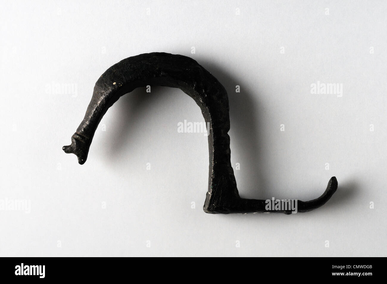 Roman fibula made of bronze from the Archaeological site of Complutum ...