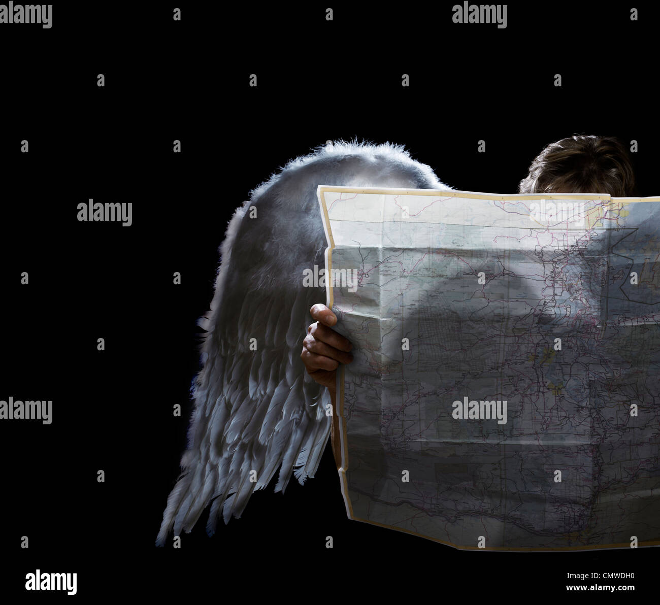 Angel looking at map Stock Photo - Alamy