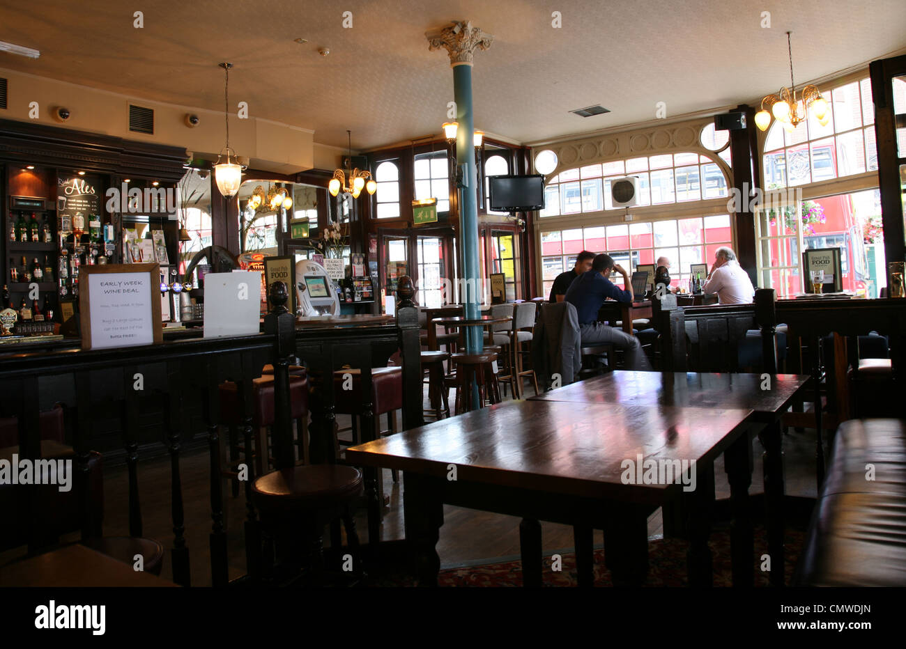 Inside view of a public house, known as pub, for drinking and ...