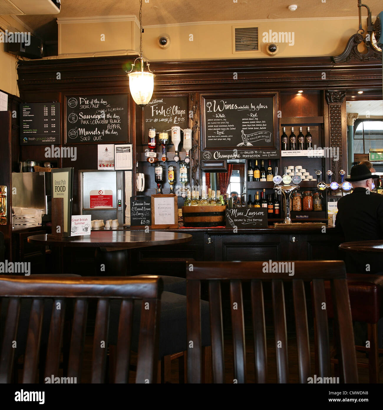 Inside view of a public house, known as pub, for drinking and ...