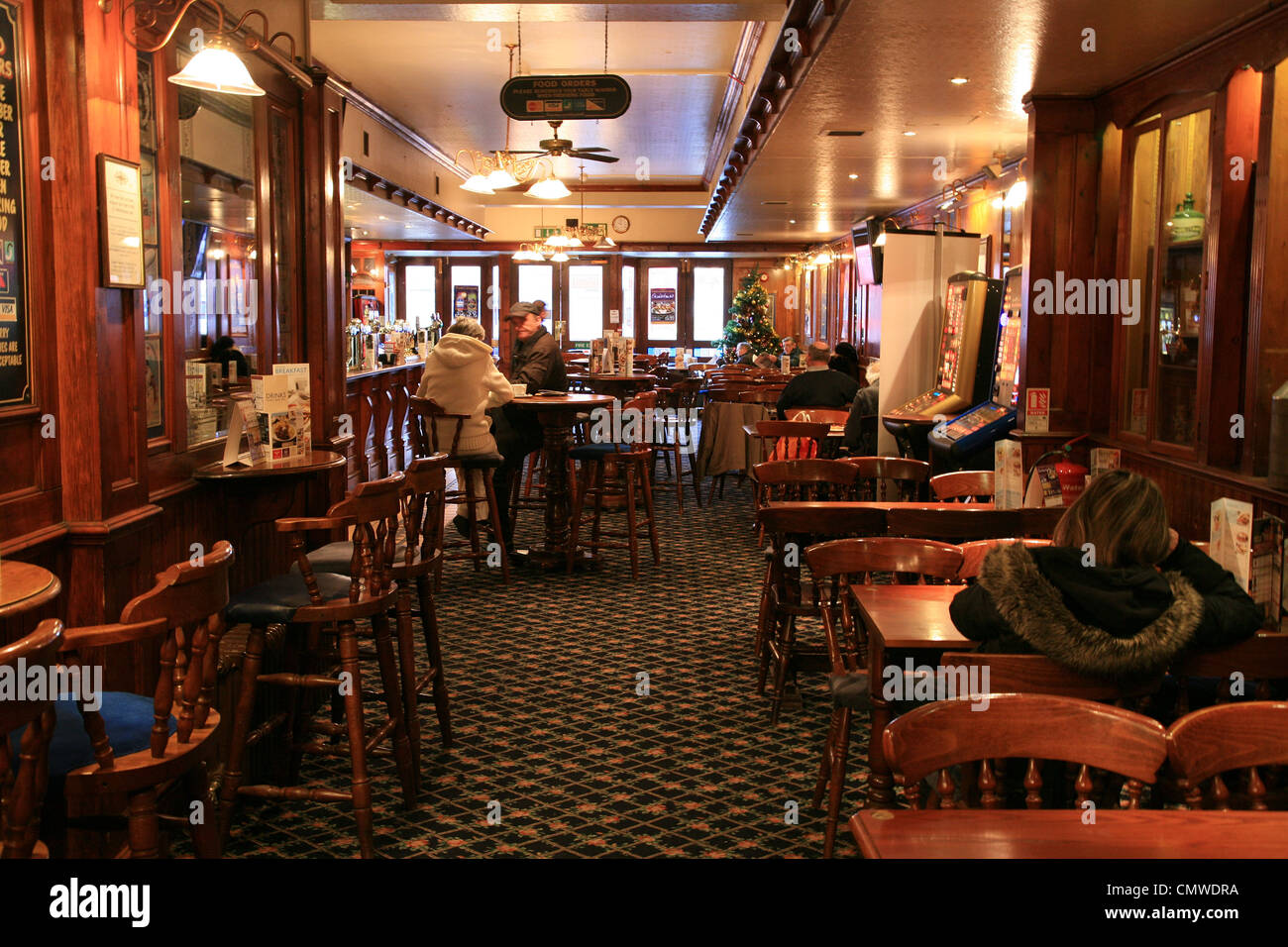 Inside view of a public house, known as pub, for drinking and ...