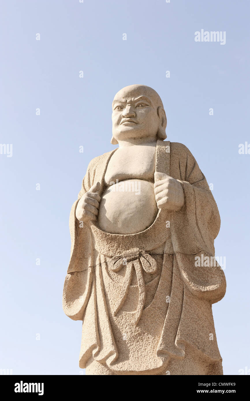 Marble buddha statue exhibited in an public garden Stock Photo - Alamy