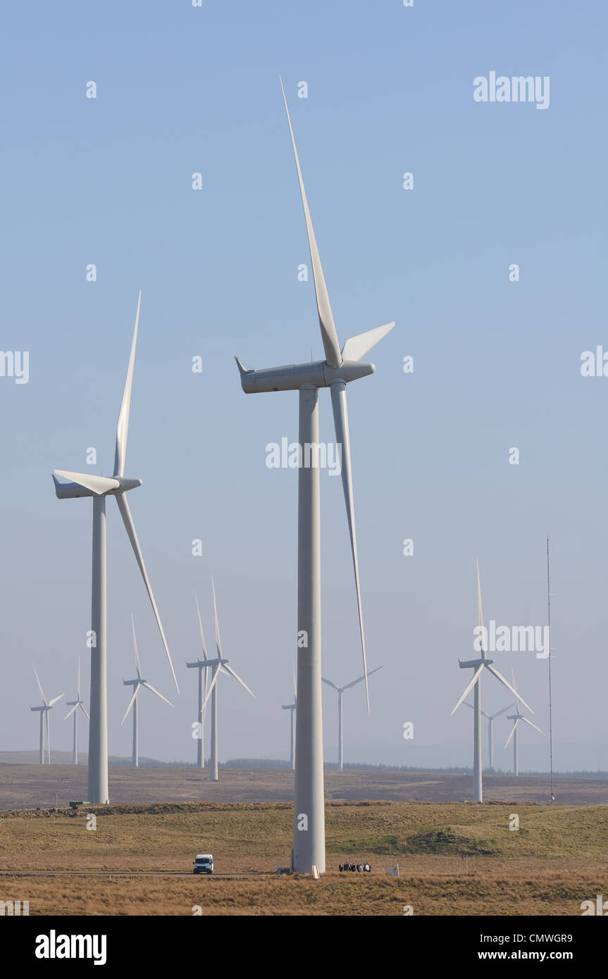Image showing the size and scale of wind turbines and farm. There is a ...