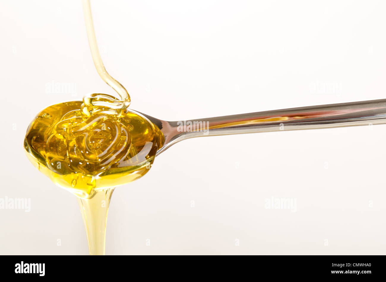 Honey spoon hi-res stock photography and images - Alamy