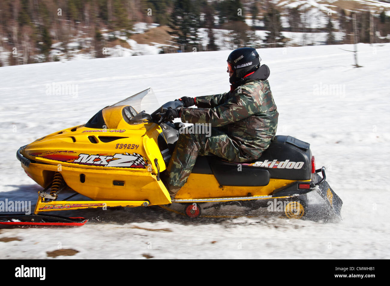 Driving snowmobile. Krynica ski resort, Beskidy Mountains, Poland Stock ...