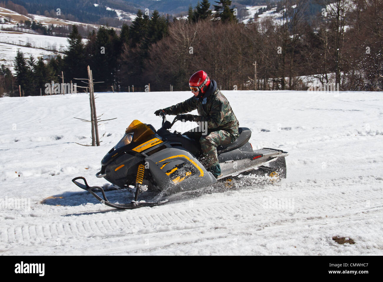Driving snowmobile. Krynica ski resort, Beskidy Mountains, Poland Stock ...