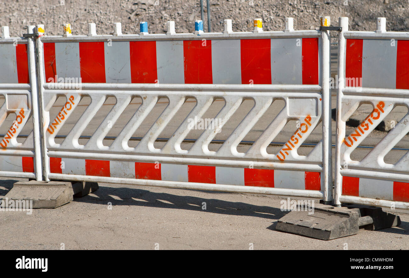 Red-white striped street barrier Stock Photo - Alamy