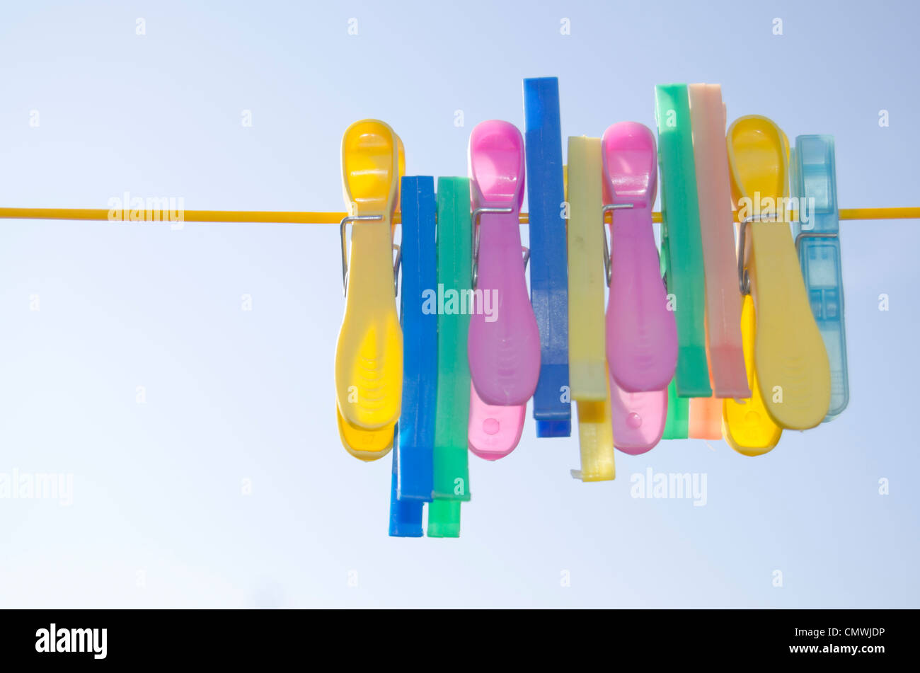 Pegs on a washing line Stock Photo - Alamy