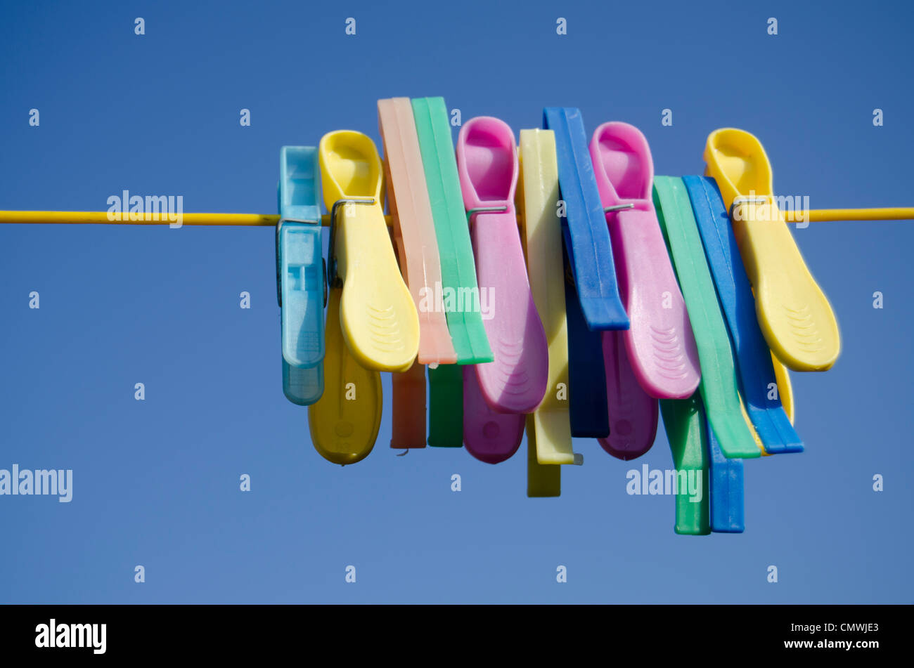Pegs on a washing line Stock Photo - Alamy