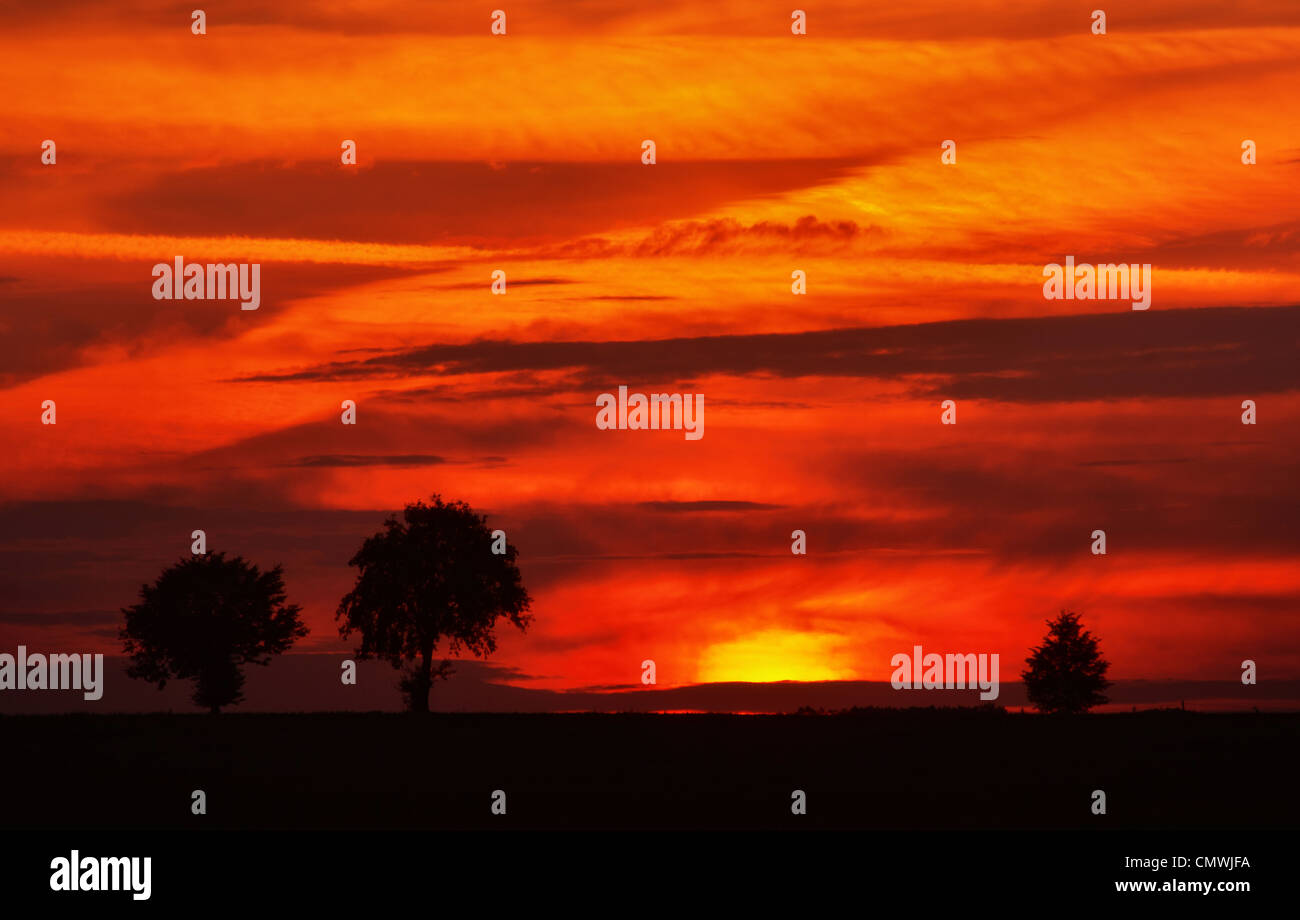 Beautiful sunset over fields Stock Photo - Alamy