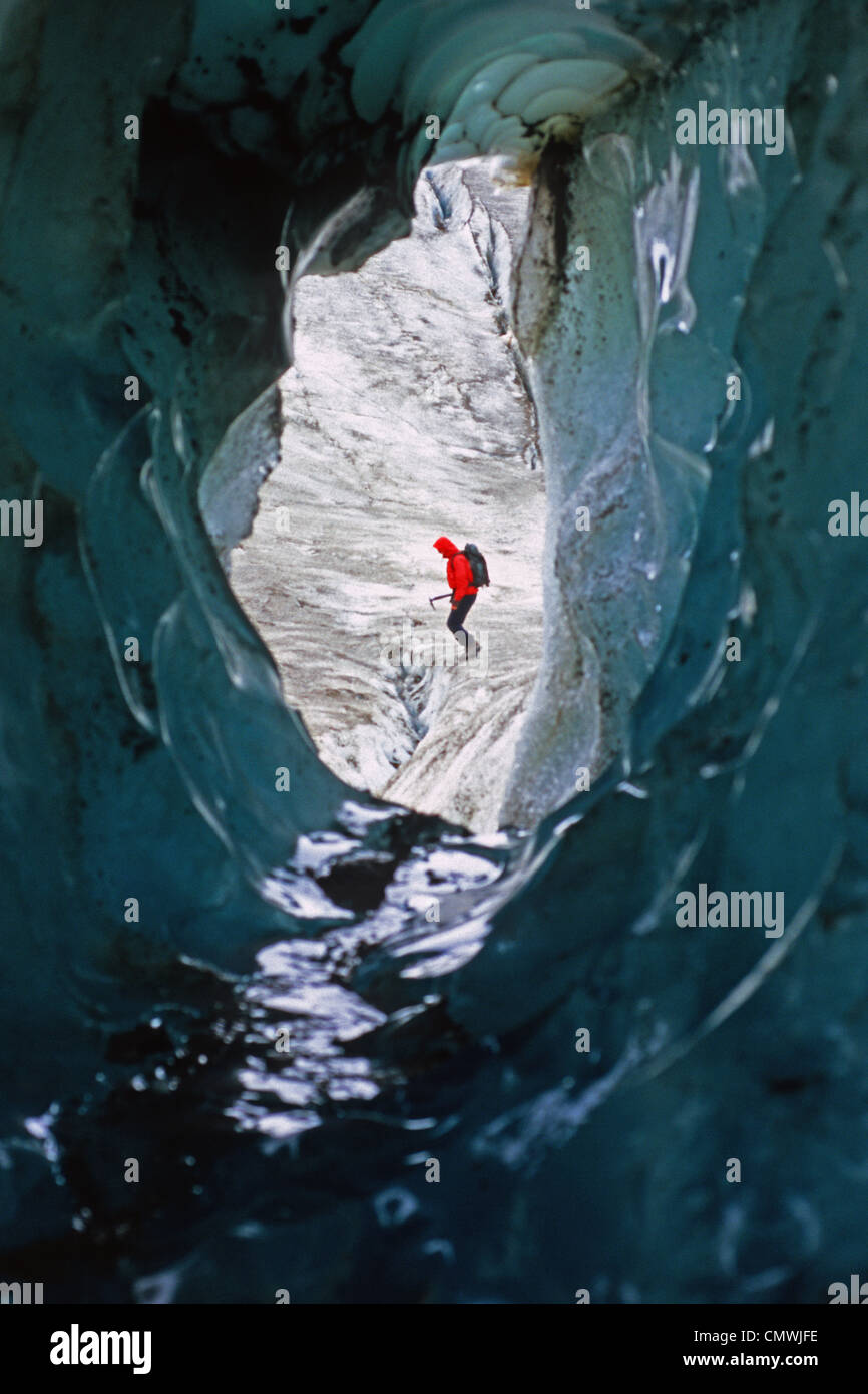 Hiker Exploring a Small Ice Cave on the Llewellyn Glacier, Atlin ...