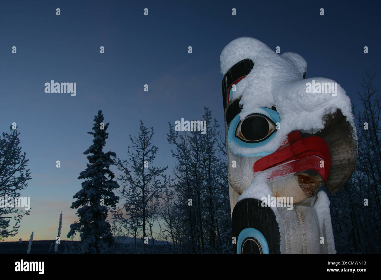 Snow Covered Totem Pole at Sunset, outside Teslin, Yukon Stock Photo ...