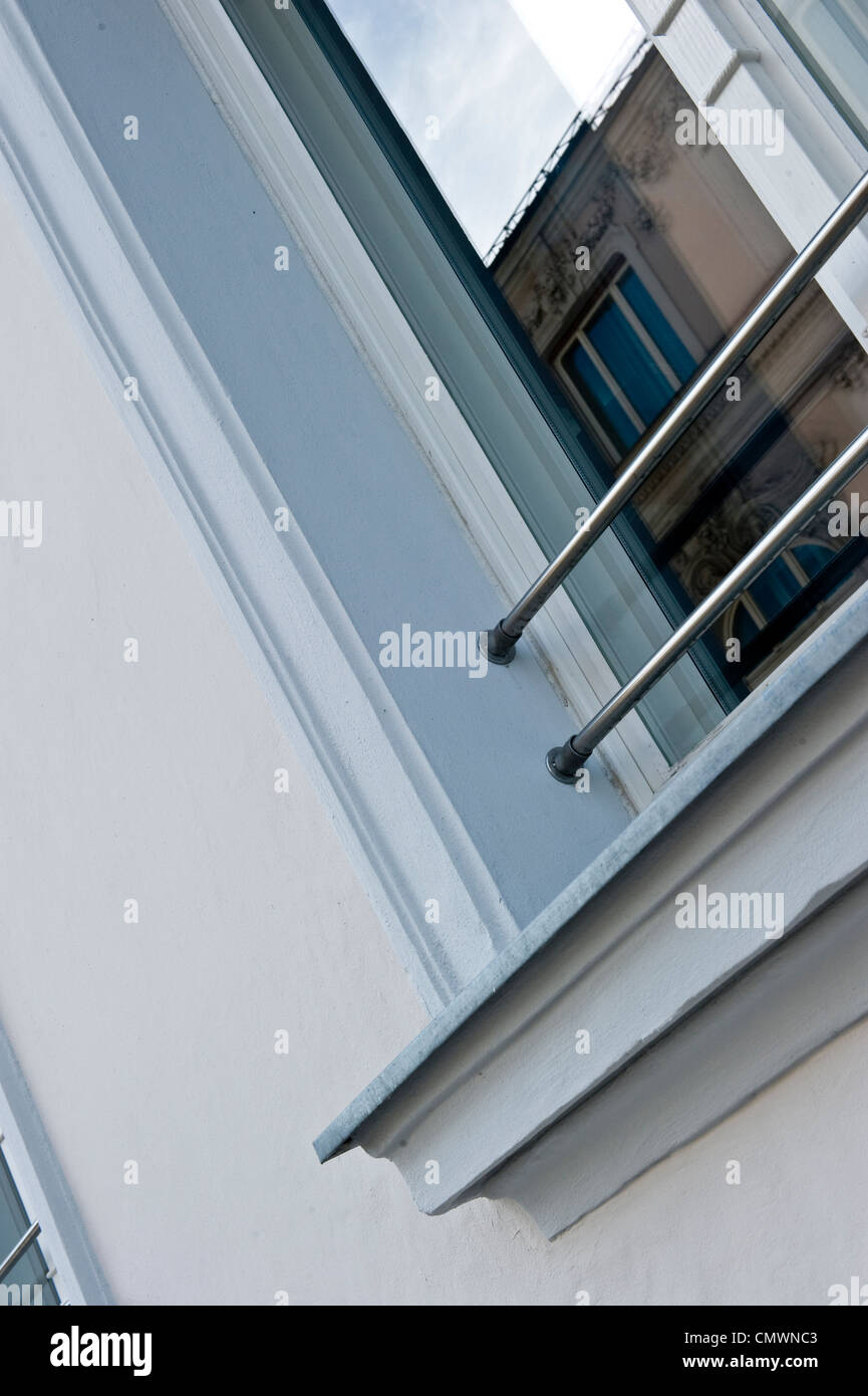 A diagonal shot of a window in Europe reflecting an old building Stock ...