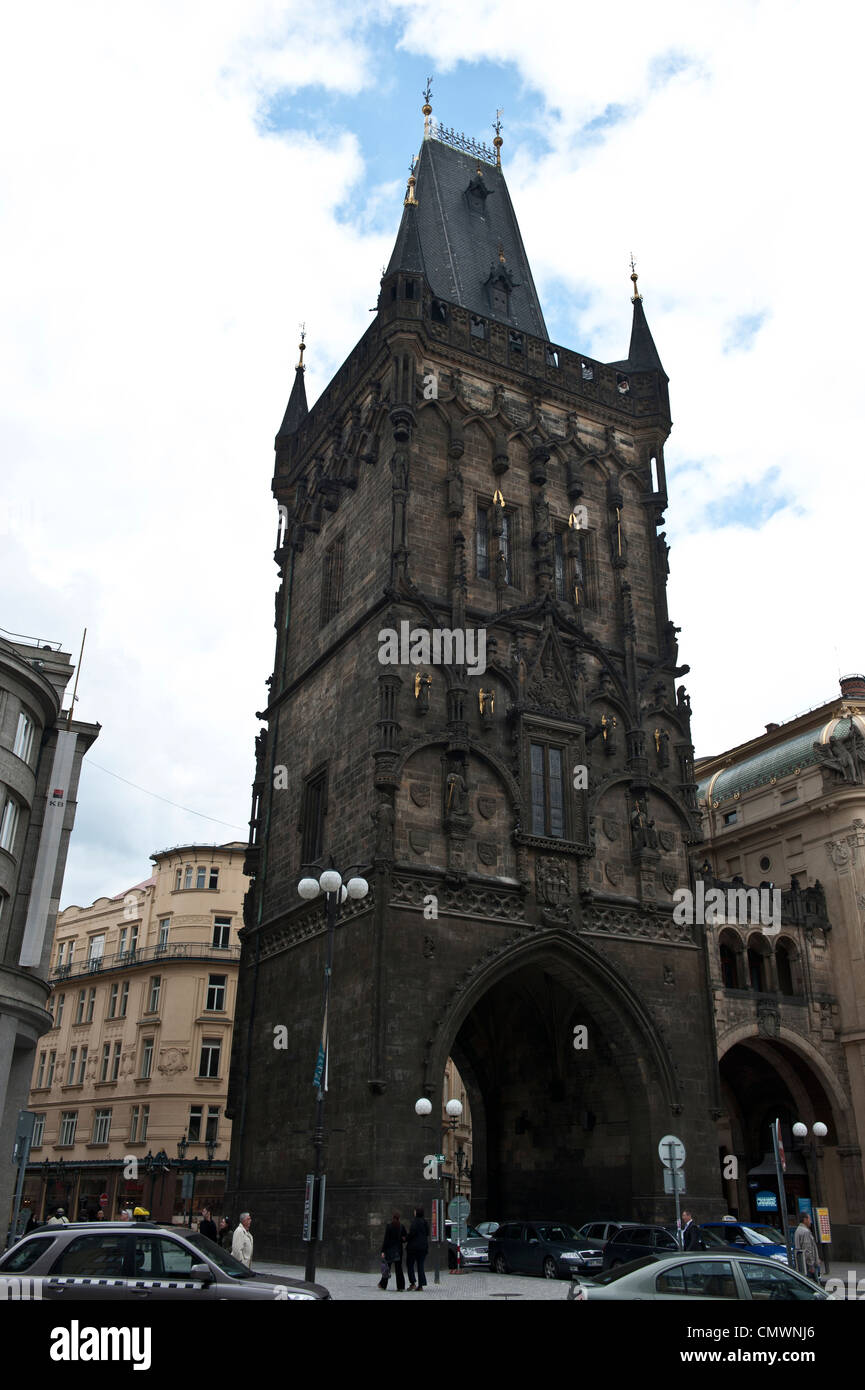 An intricately designed archway tower positioned in a city of Czech ...