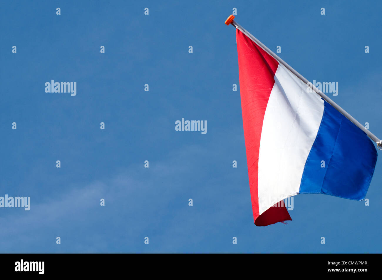 The Dutch flag hanging on a flagpole Stock Photo - Alamy